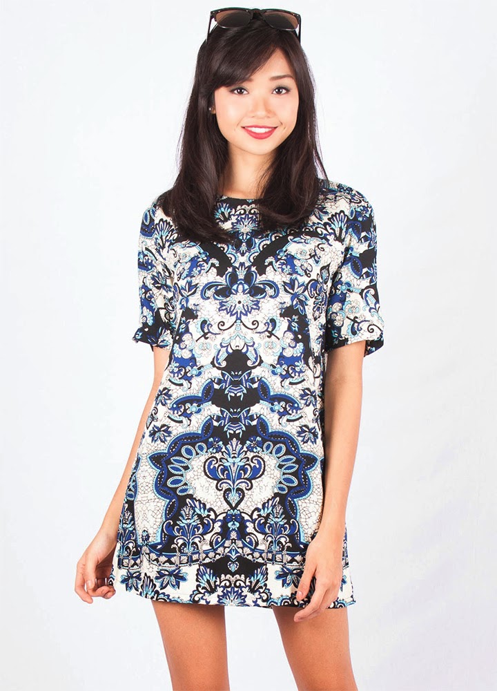The cloth is a Abstract Mirrored Print Dress.